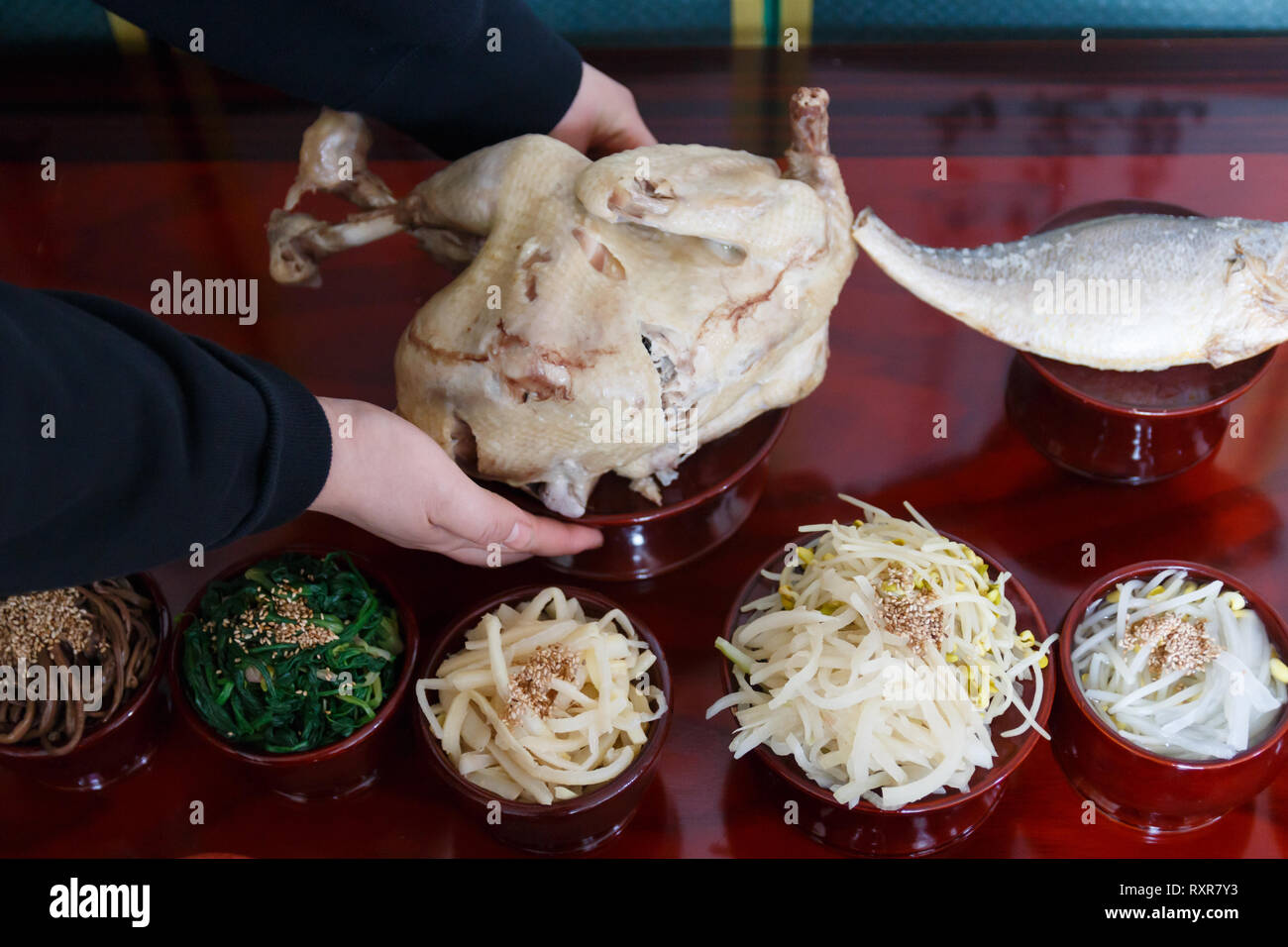 chicken, fish and seasoned Korean herbs (balloon flower root, spinach ...