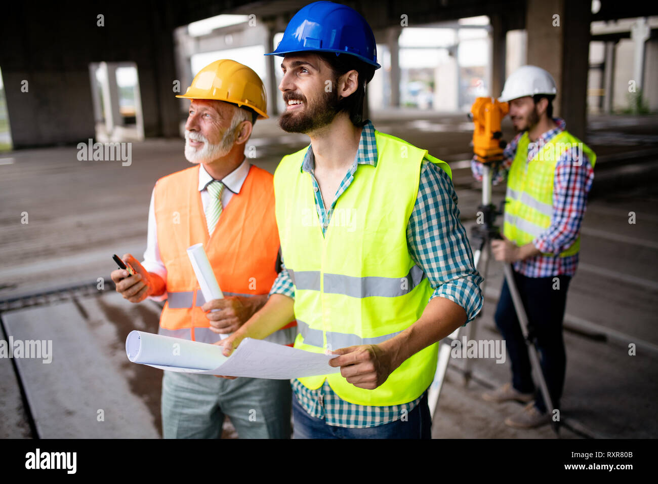 Group of construction engineer working in construction site Stock Photo ...