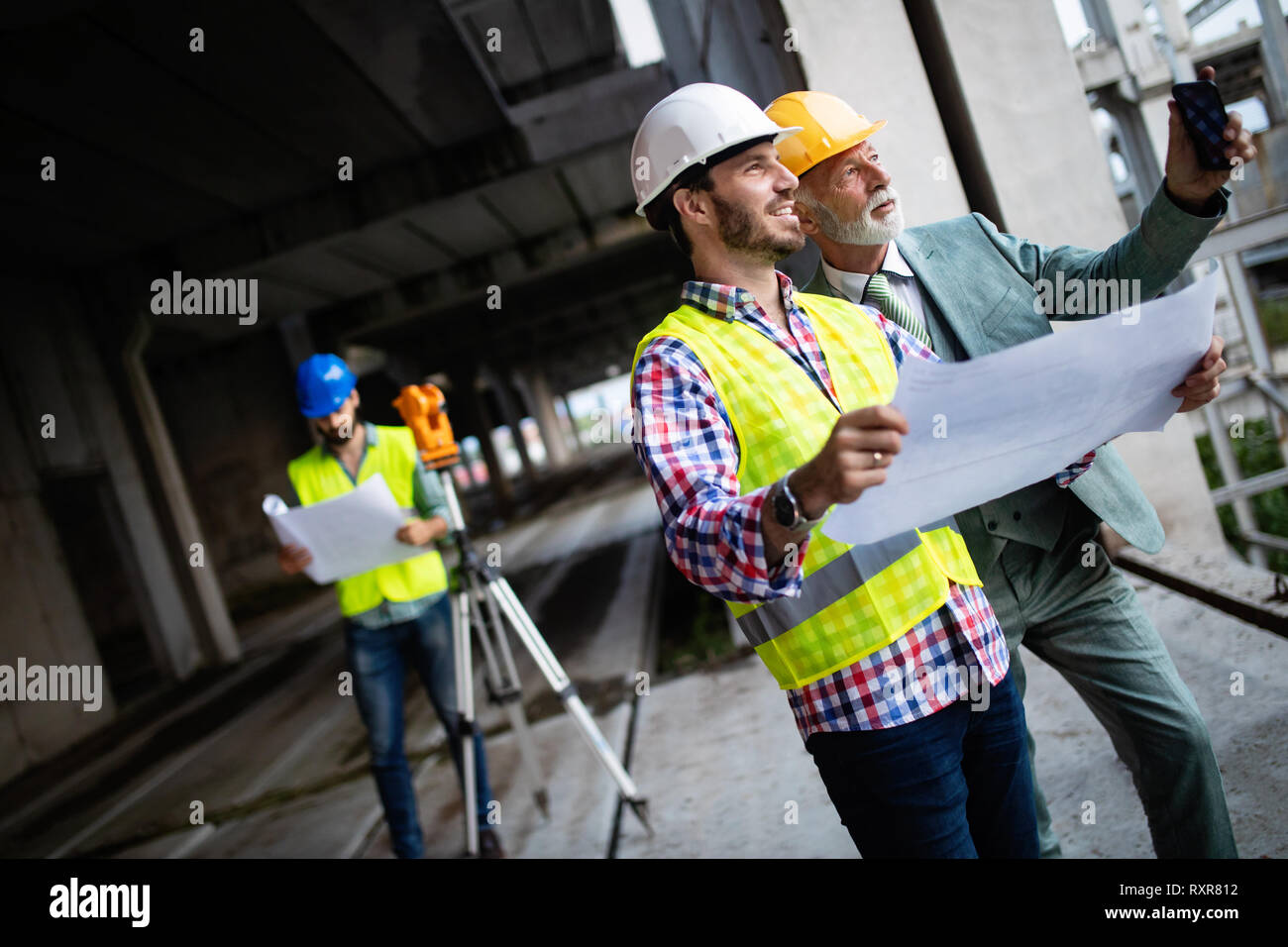 Group of construction engineer working in construction site Stock Photo ...