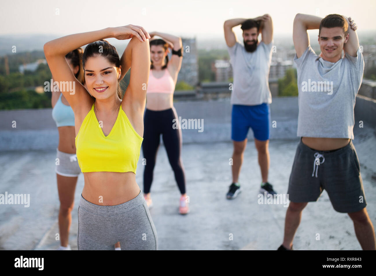 Fitness class exercising outside hi-res stock photography and images ...