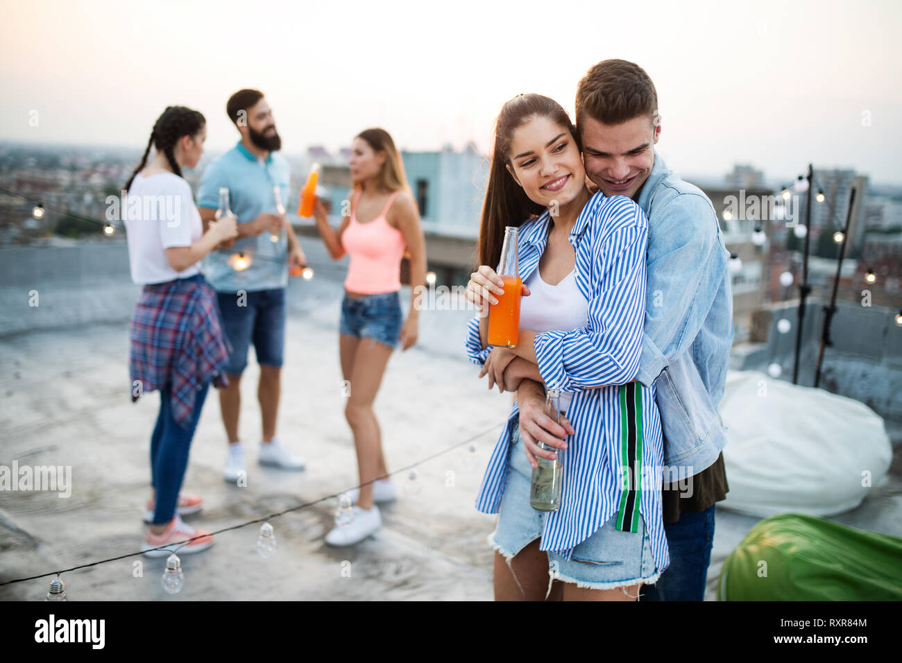 Happy lovely couple having fun time at party Stock Photo - Alamy