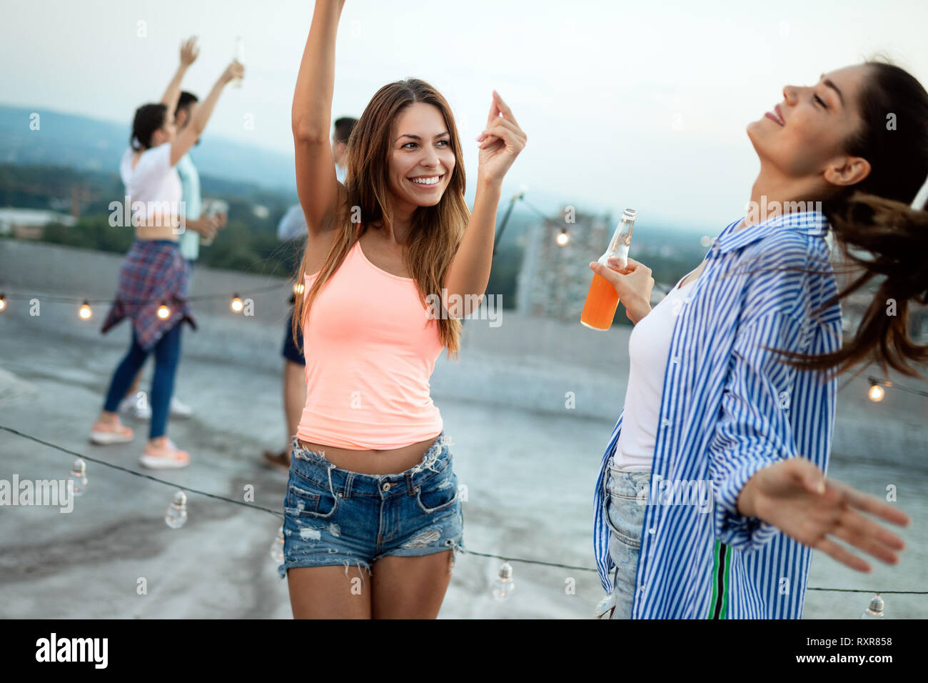 Group of young happy friends having party and fun Stock Photo - Alamy