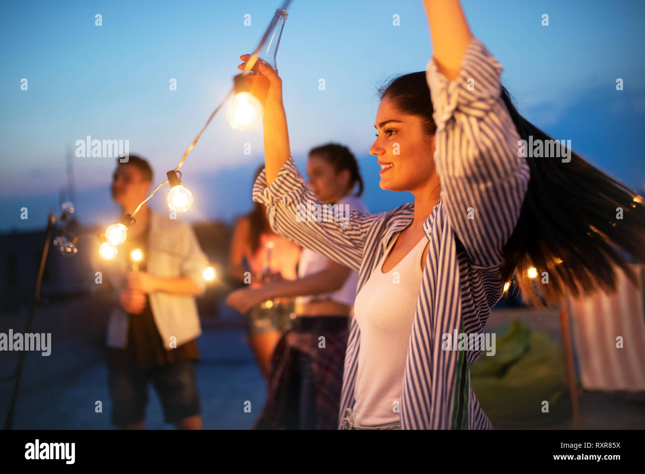 Female party night lights hi-res stock photography and images - Alamy