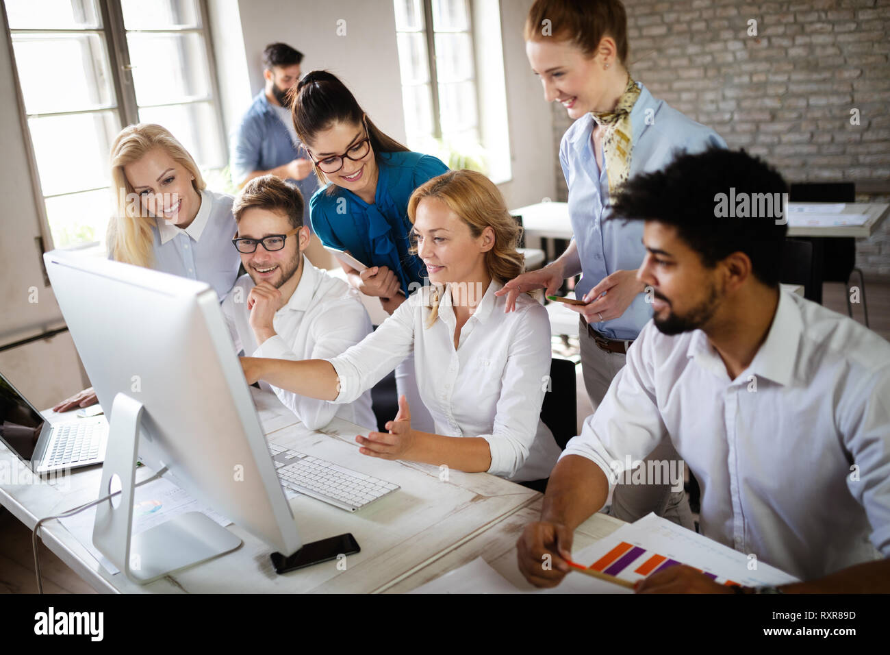 Successful happy group of people learning software engineering and ...