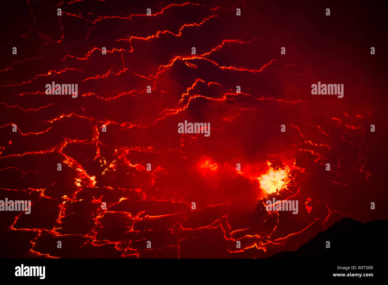 The lava lake at the top of Nyiragongo Volcano in the DRC Stock Photo ...