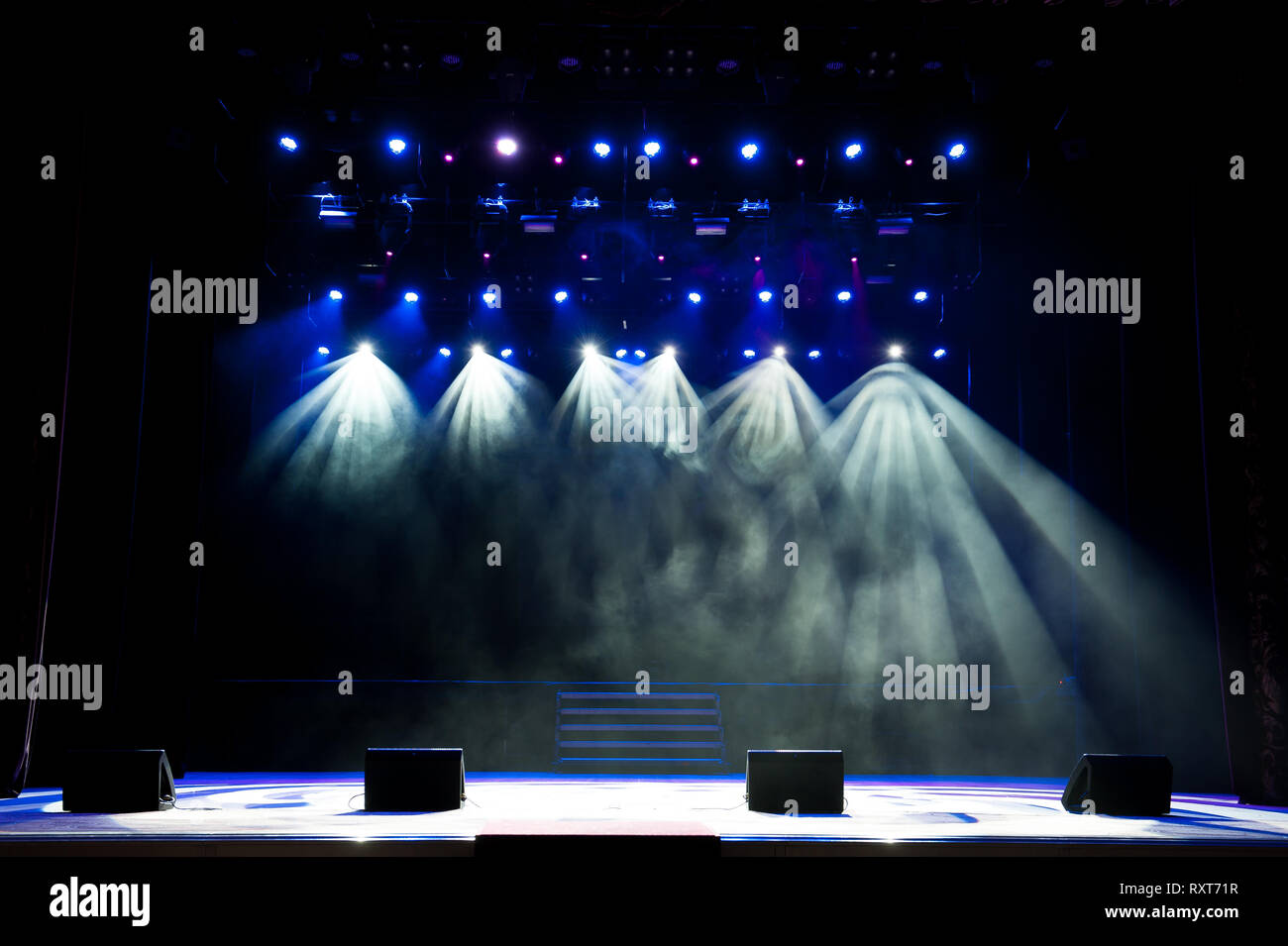 Free stage with lights, lighting devices. Night show Stock Photo - Alamy