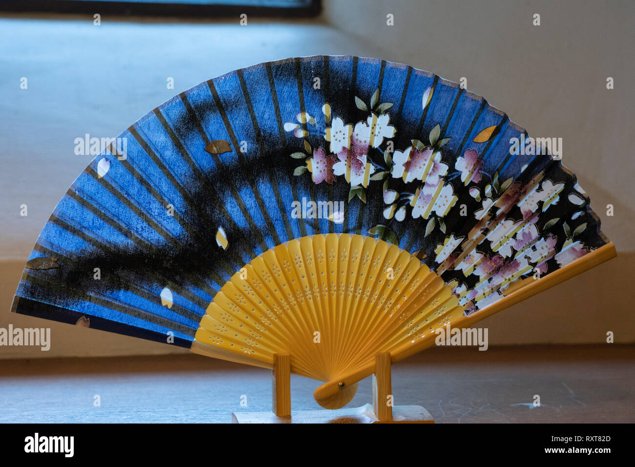 Floral themed open Japanese folding Fan Stock Photo - Alamy