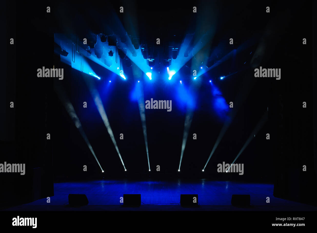 Free stage with lights, lighting devices. Night show Stock Photo - Alamy