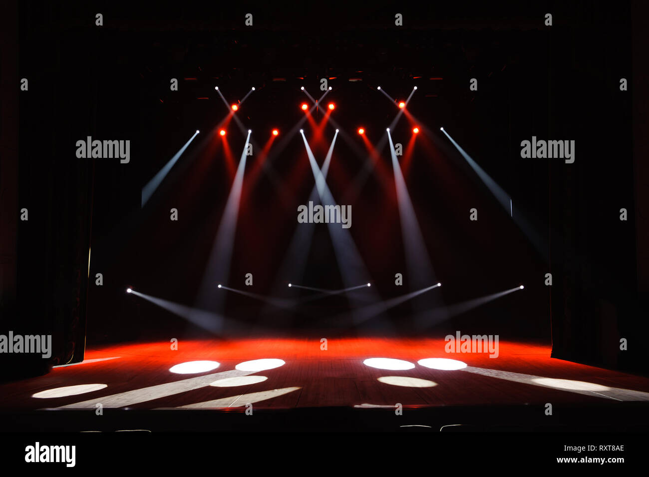 Free stage with lights, lighting devices. Night show Stock Photo - Alamy
