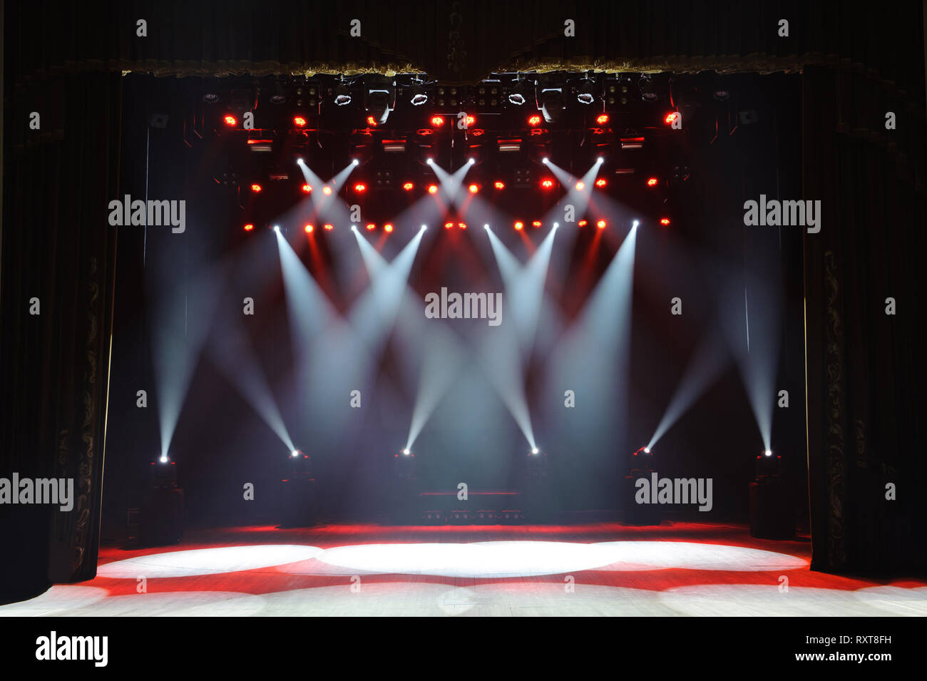 Free stage with lights, lighting devices. Night show Stock Photo - Alamy