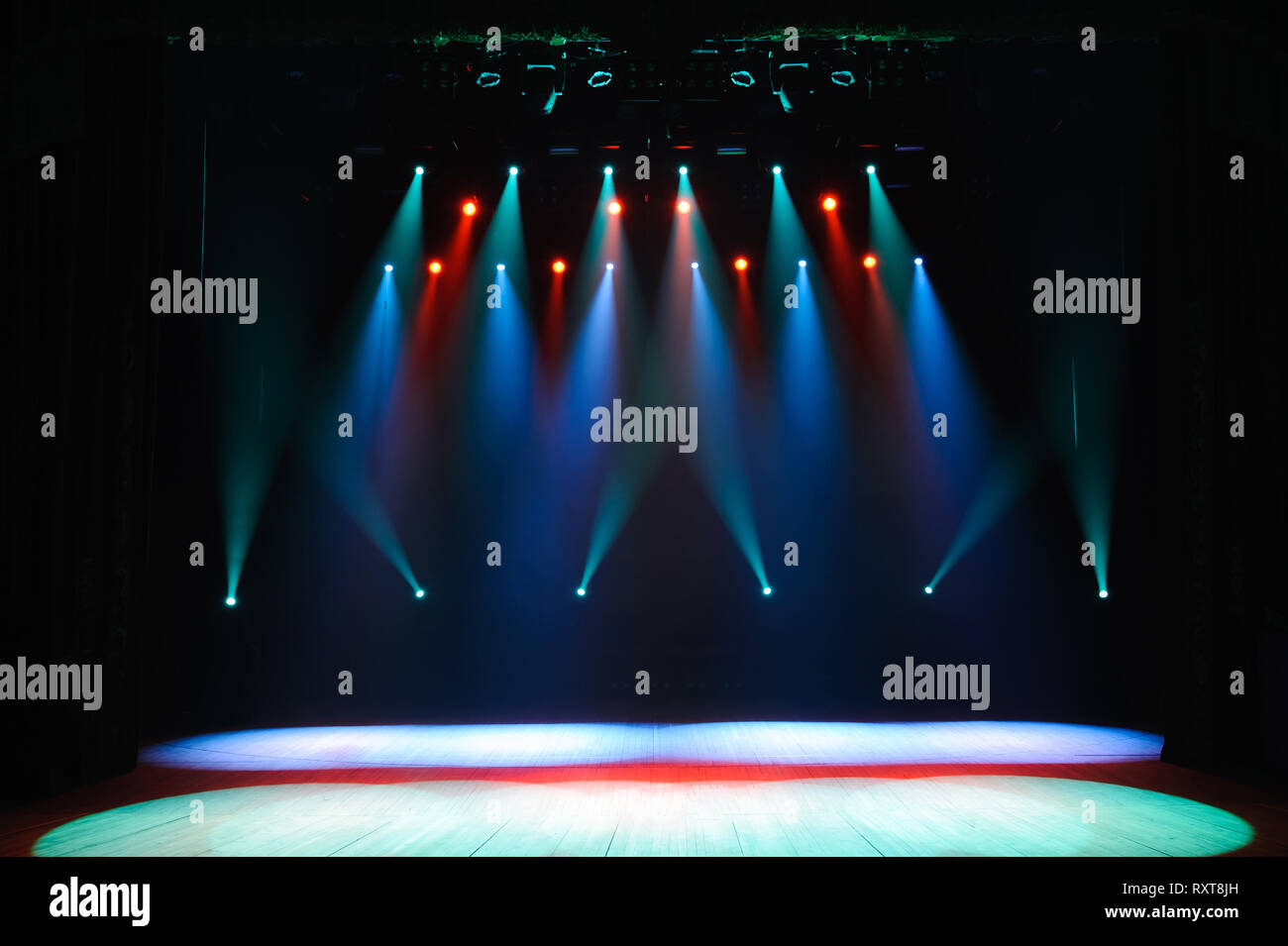 Free stage with lights, lighting devices. Night show Stock Photo - Alamy