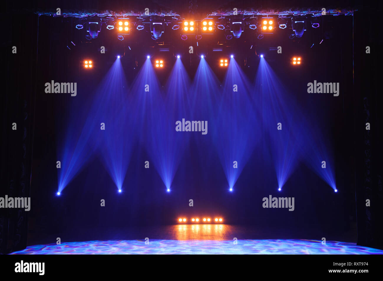 Free stage with lights, lighting devices. Night show Stock Photo - Alamy