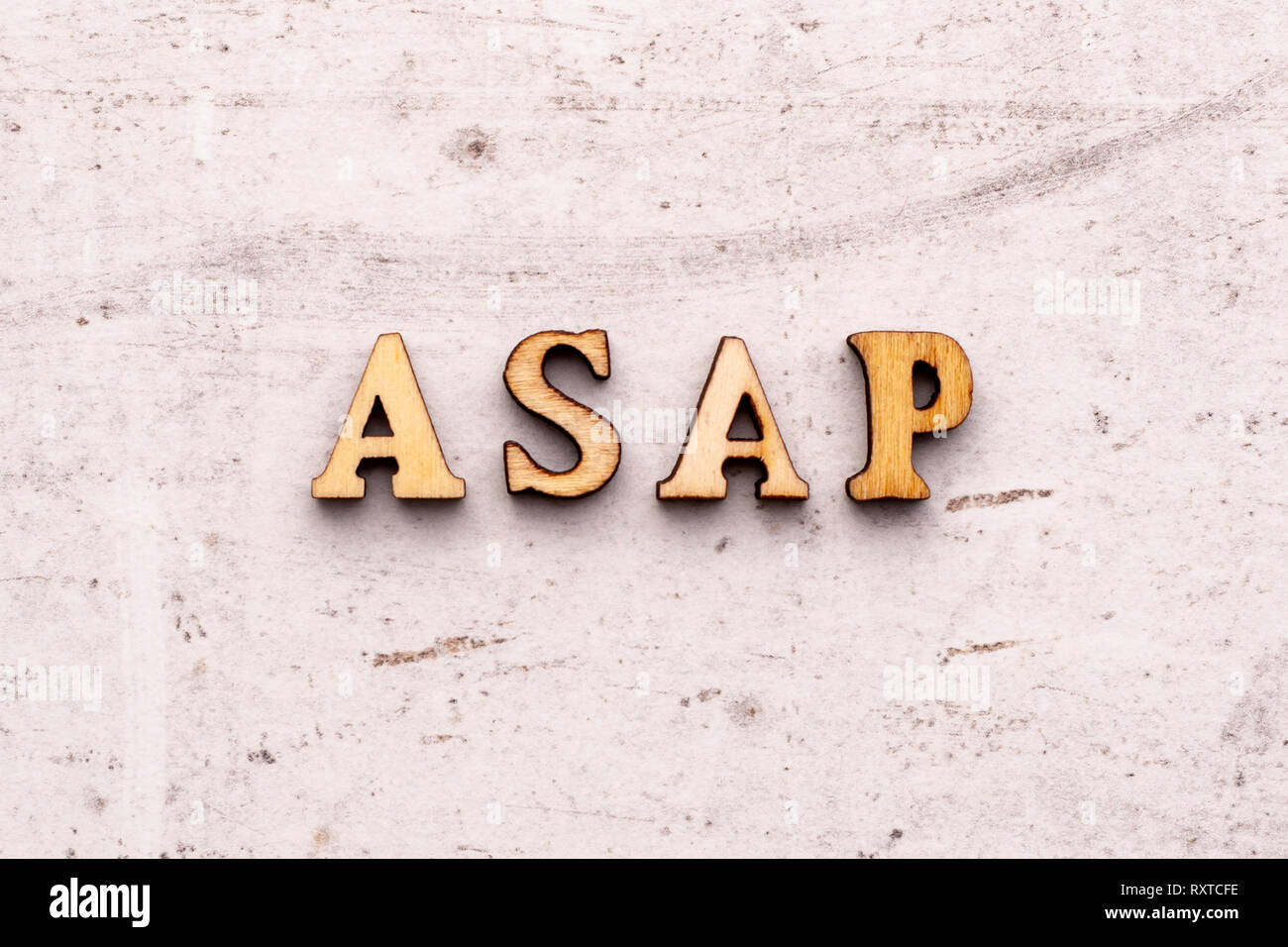 Inscription ASAP as soon as posisioble abbreviation in wooden letters ...