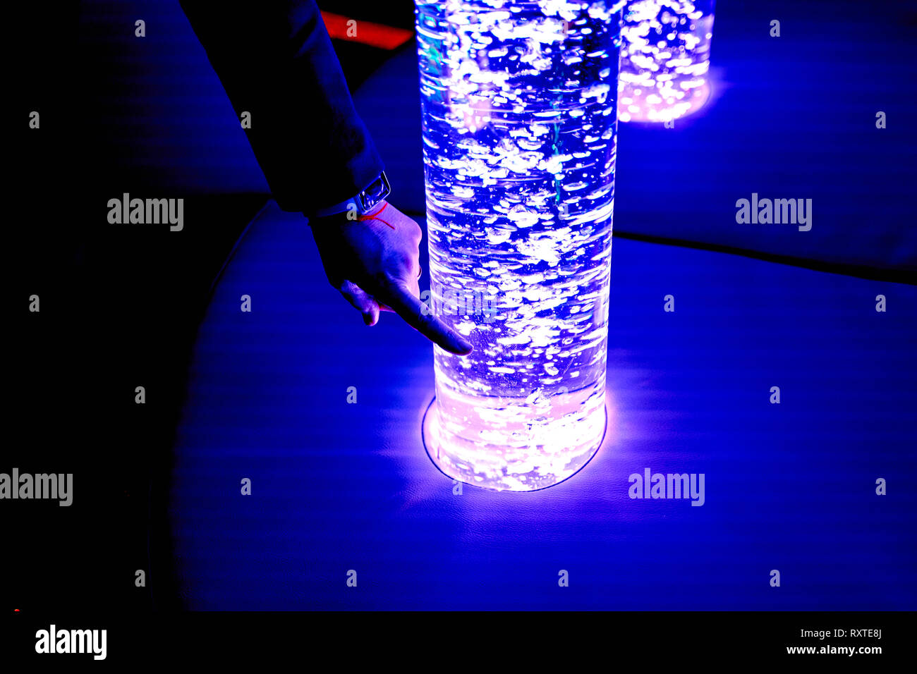 therapy sensory stimulating multi sensory room, woman interacting with ...