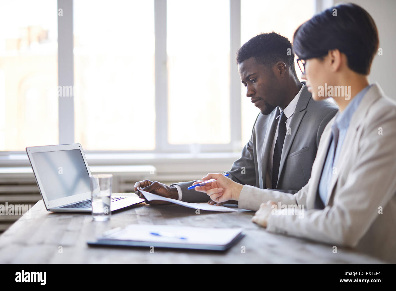 Colleagues at work Stock Photo - Alamy