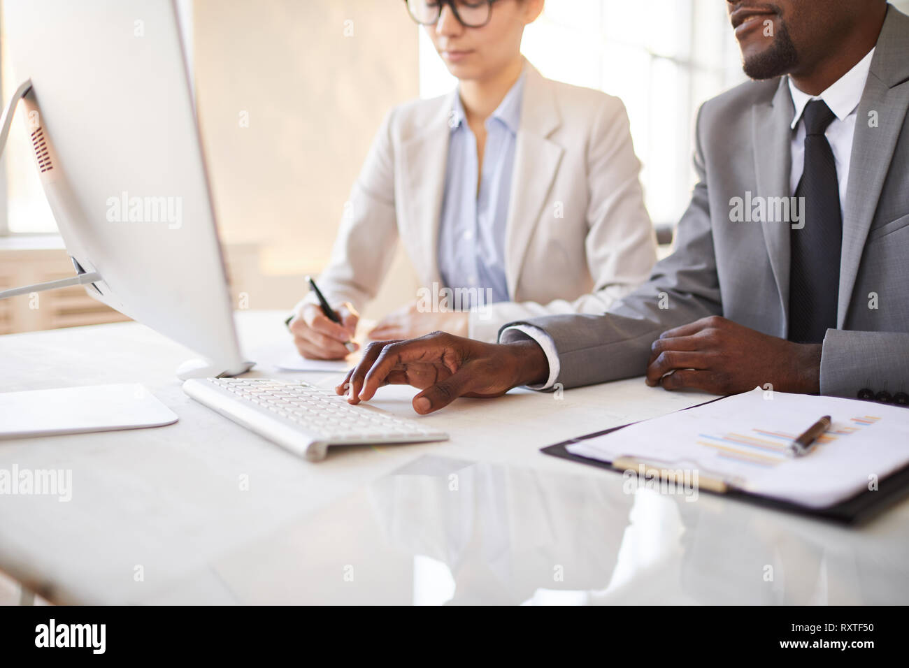 Colleague pushing businessman hi-res stock photography and images - Alamy