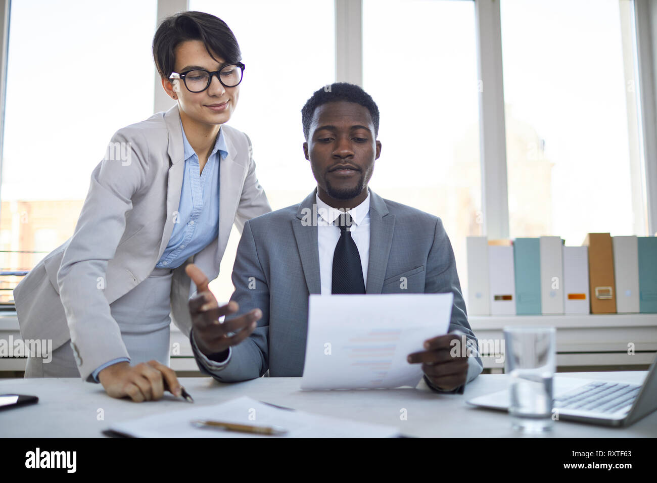 Looking through contract Stock Photo - Alamy