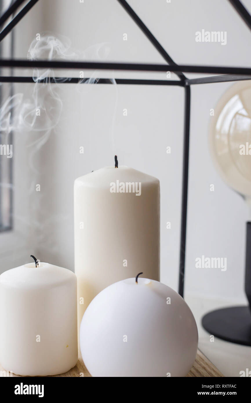 Scandinavian minimalist decor on the windowsill - white candles with ...