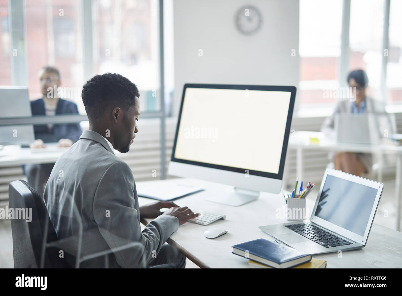 Working in front of computer screen Stock Photo - Alamy