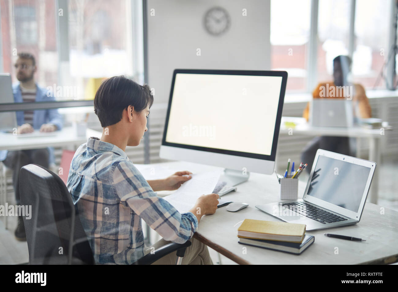 Manager reading papers Stock Photo - Alamy