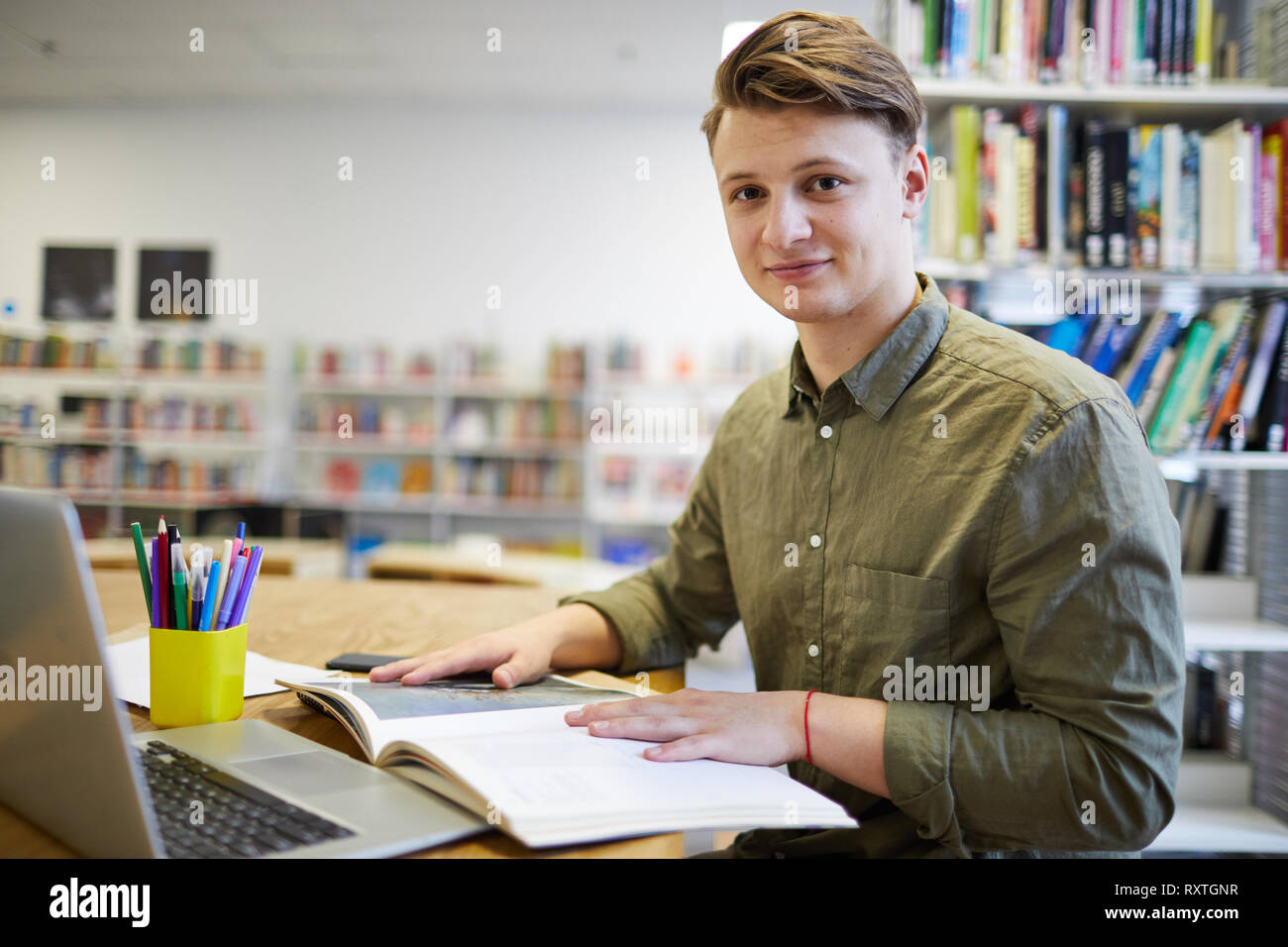 Guy with book Stock Photo - Alamy