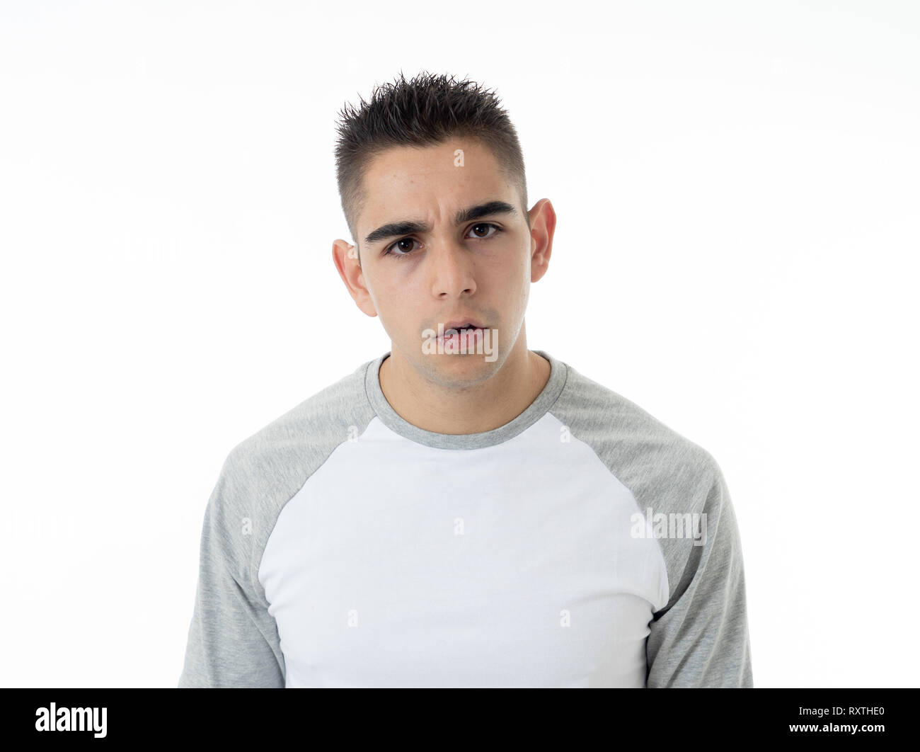 Portrait of angry and upset young man looking furious, aggressive and ...