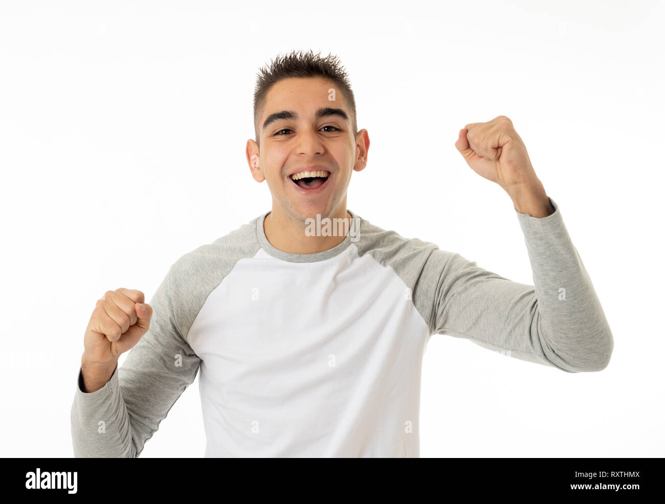 Portrait of young man celebrating achieving his goal, wining the ...