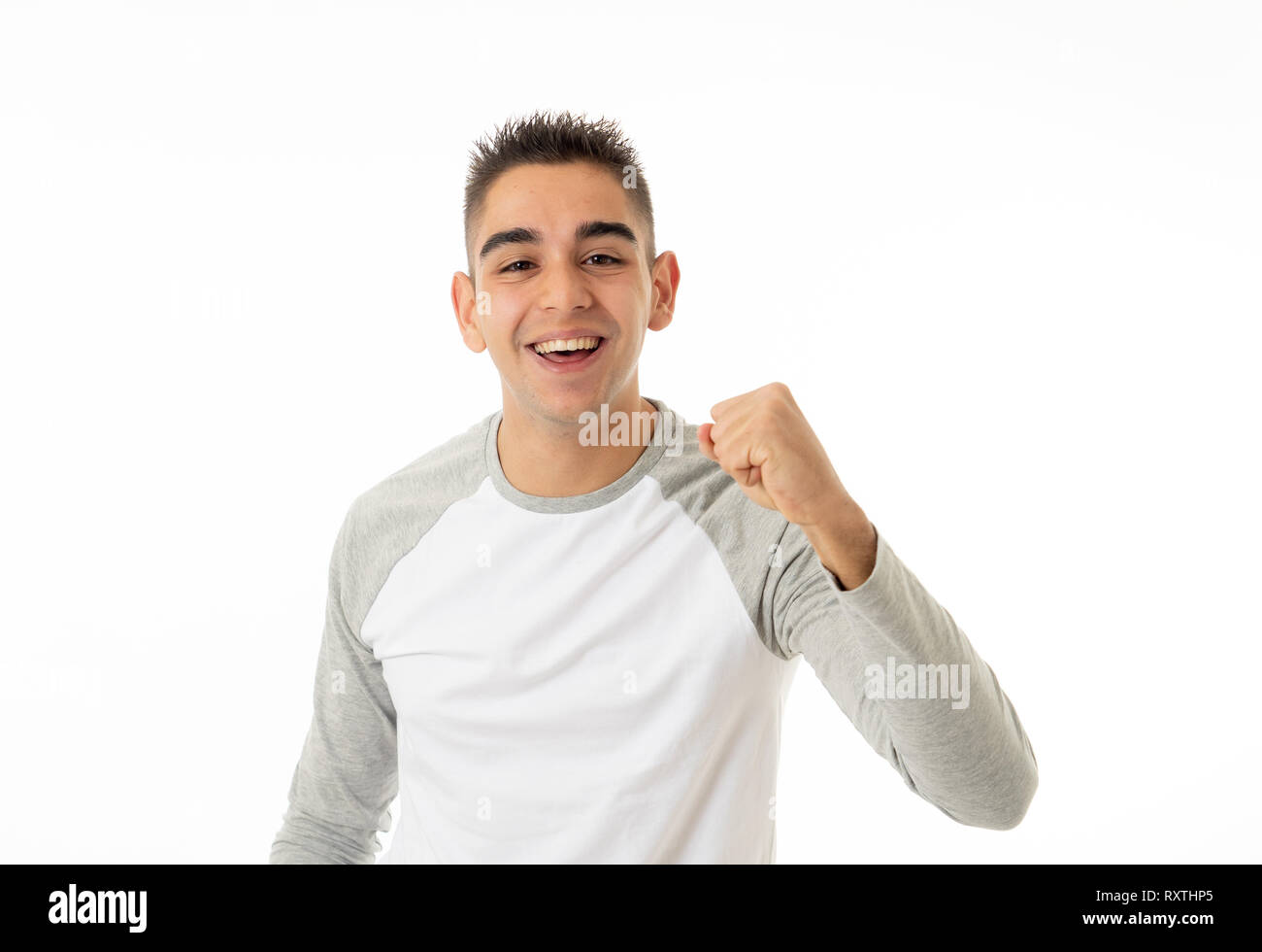 Portrait of young man celebrating achieving his goal, wining the ...