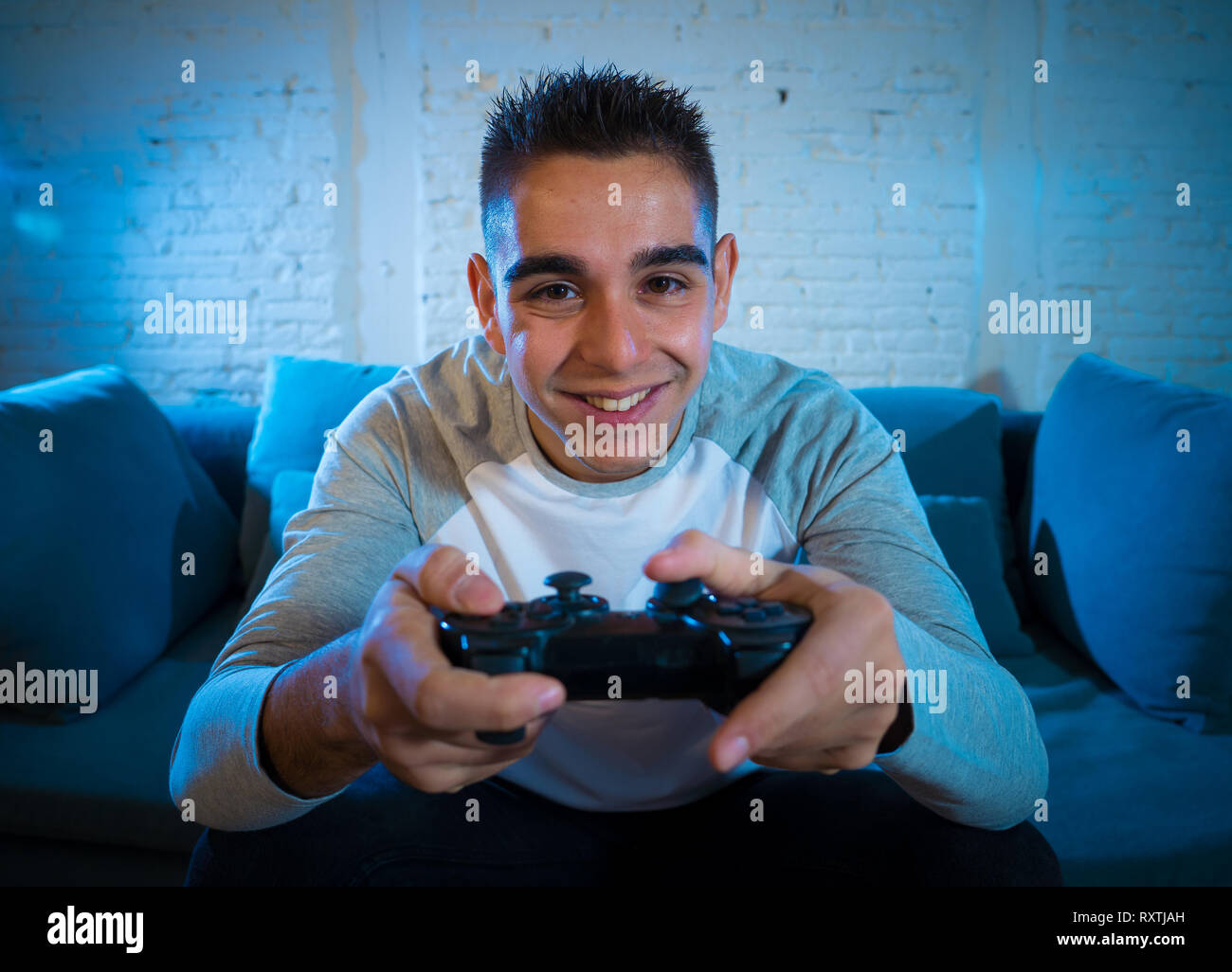 Portrait of young student man playing video games having fun winning ...