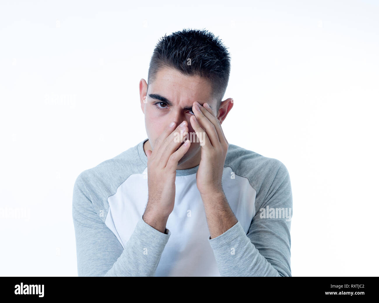 Portrait of young man in shock with scared face making frightened ...