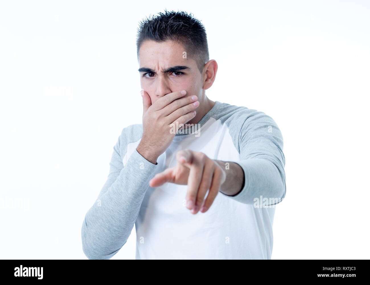 Portrait of young man in shock with scared face making frightened ...