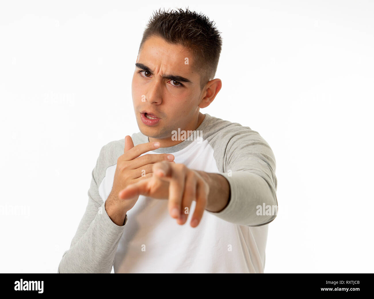 Portrait of young man in shock with scared face making frightened ...