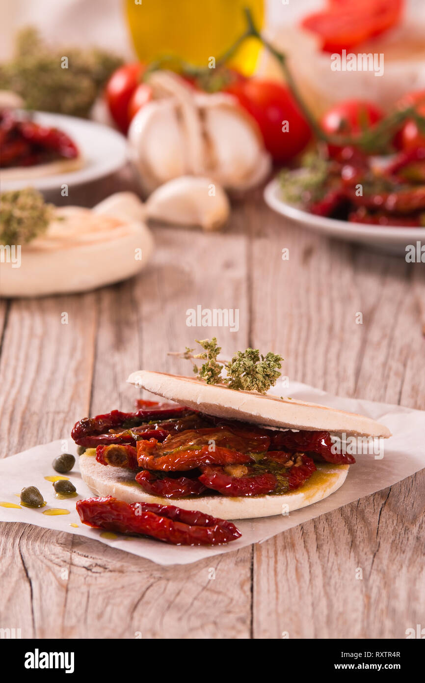 Tigella bread with sun-dried tomatoes Stock Photo - Alamy