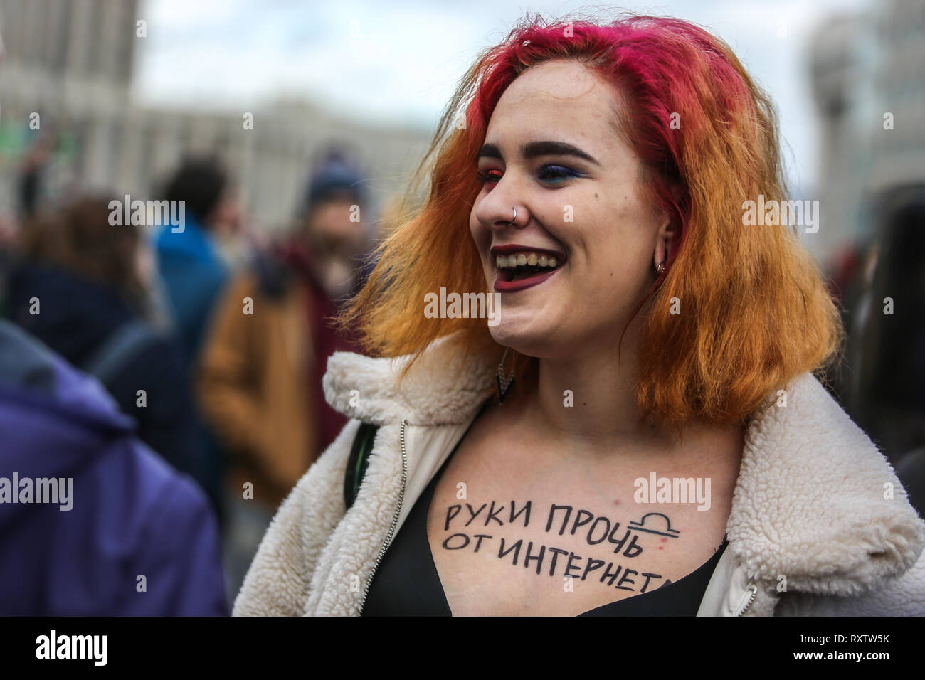 A participant with words written on her chest seen taking part during ...