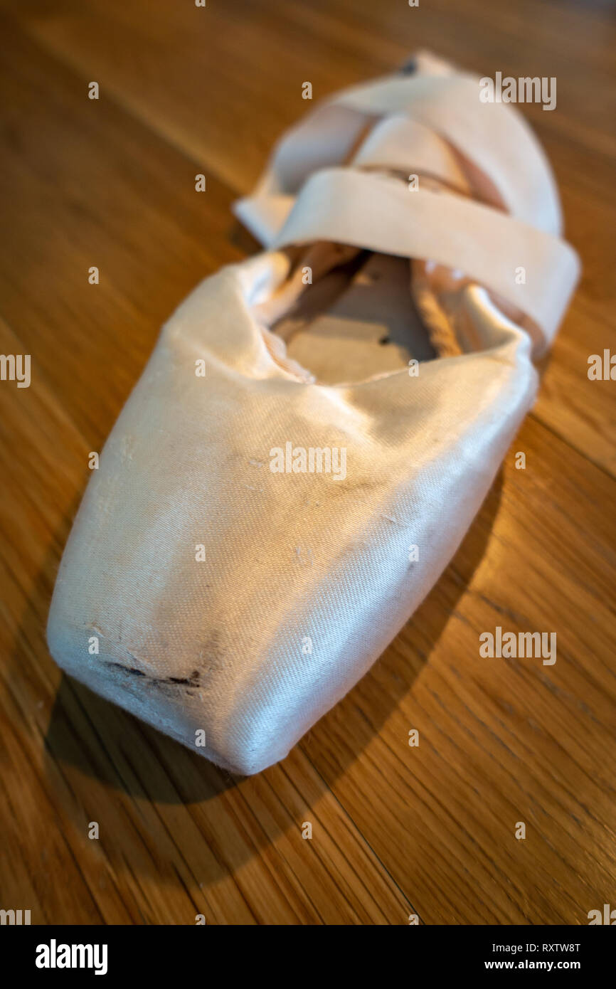 Single Classical Ballet pointe shoe, Ballerinas and Pointe Shoe on a ...