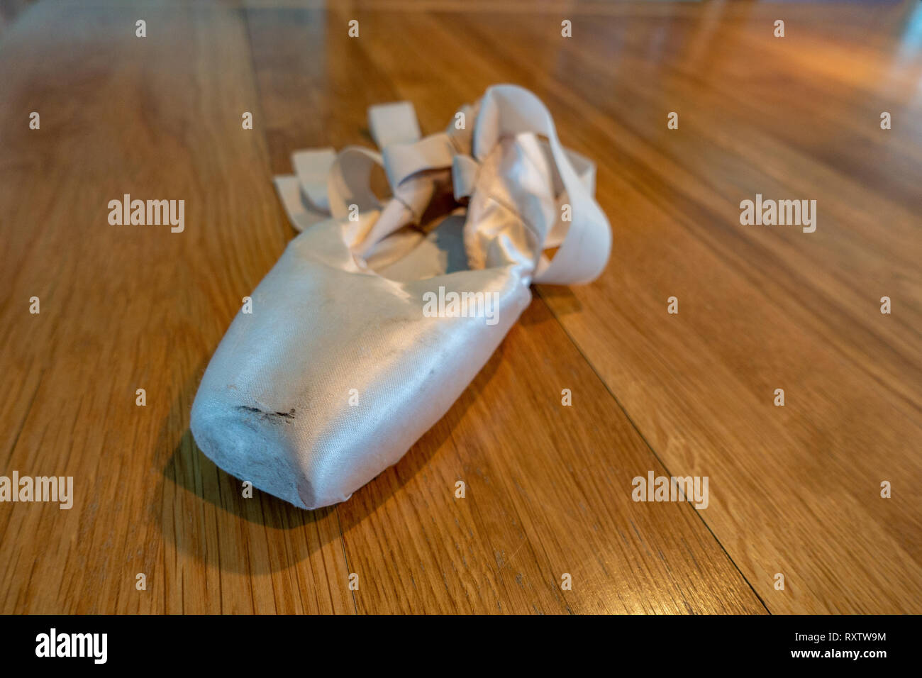 Single Classical Ballet pointe shoe, Ballerinas and Pointe Shoe on a ...