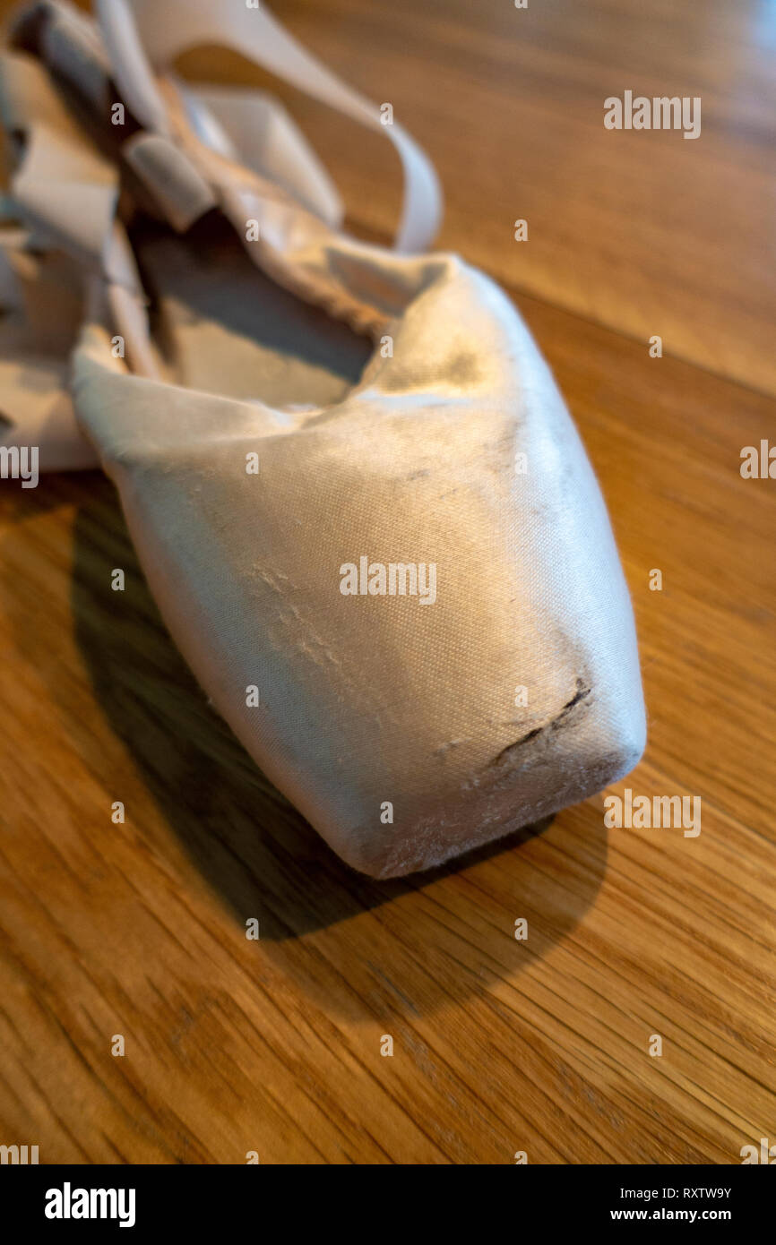 Closeup of single Classical Ballet pointe shoe, standing on tiptoes on ...