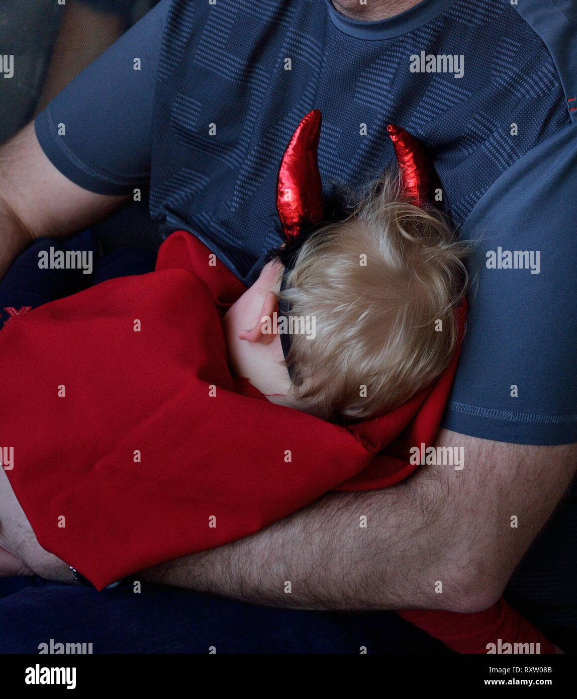 Devil holding baby hi-res stock photography and images - Alamy