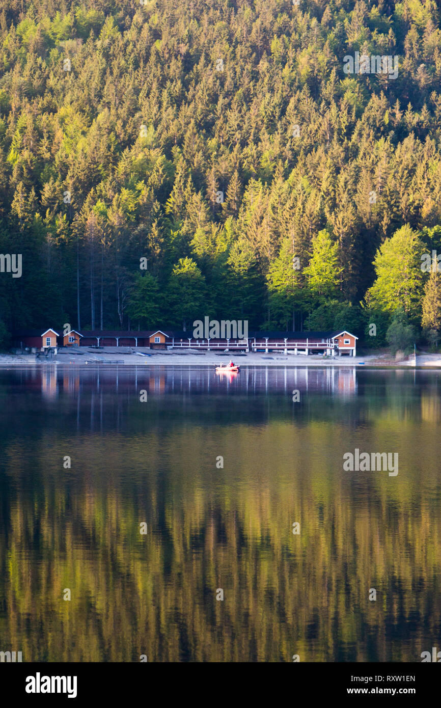 Boat and Boathouse in the early morning on a german alpine lake Stock ...