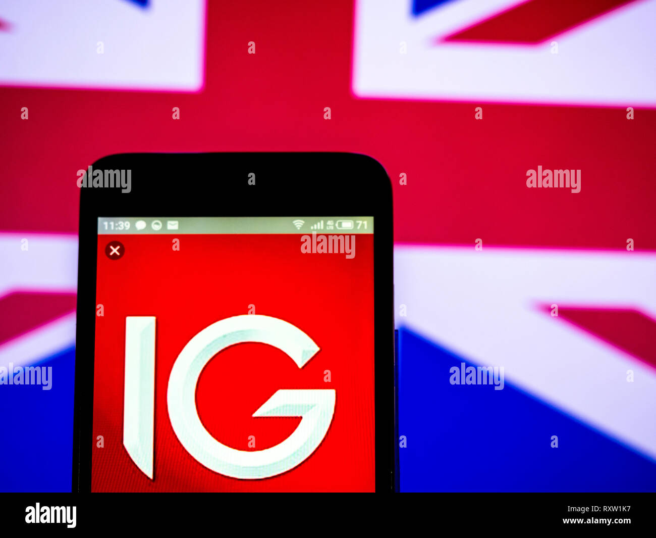 IG Group Holings plc logo seen displayed on smart phone Stock Photo - Alamy