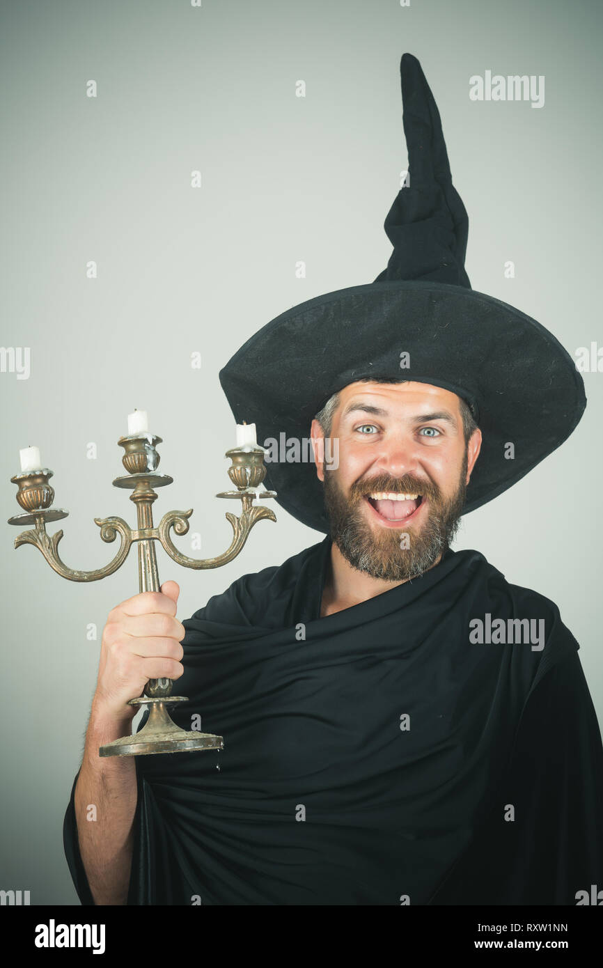 Halloween man with happy face in black witch hat Stock Photo - Alamy