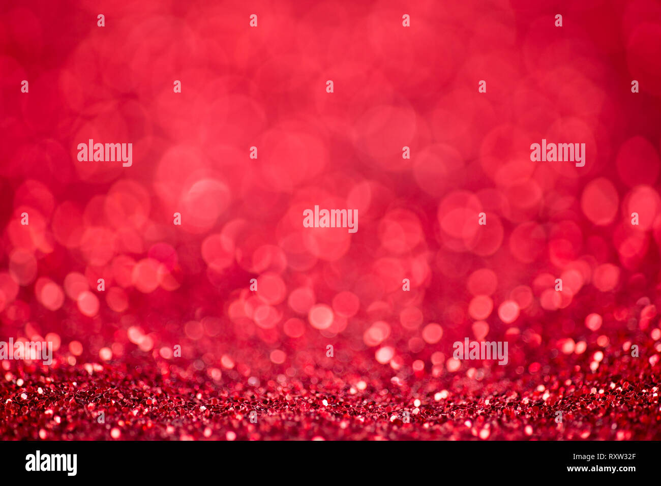 Abstract red glitter background hi-res stock photography and images - Alamy