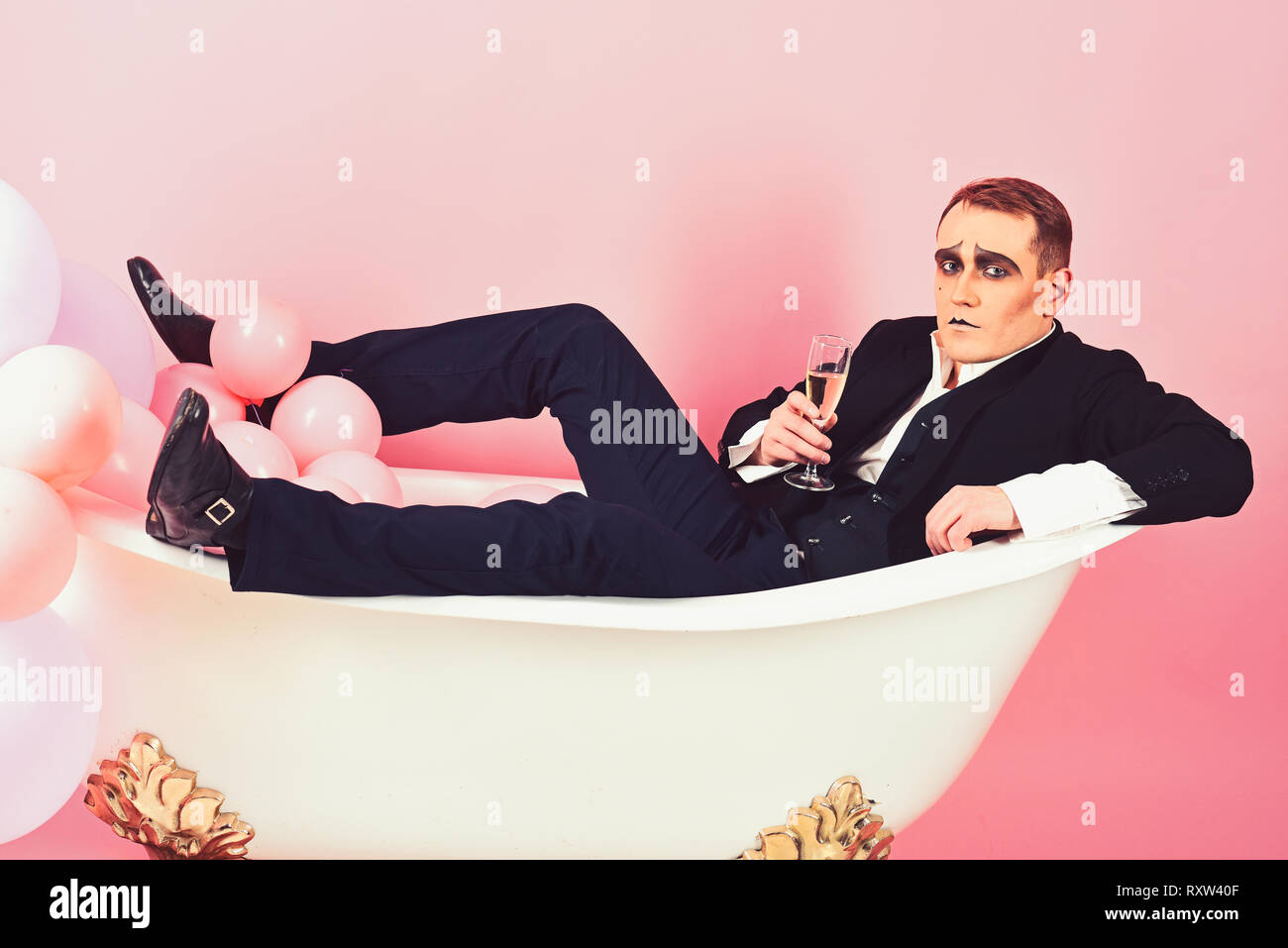 Lose yourself in your favourite drink. Mime man has celebration party ...