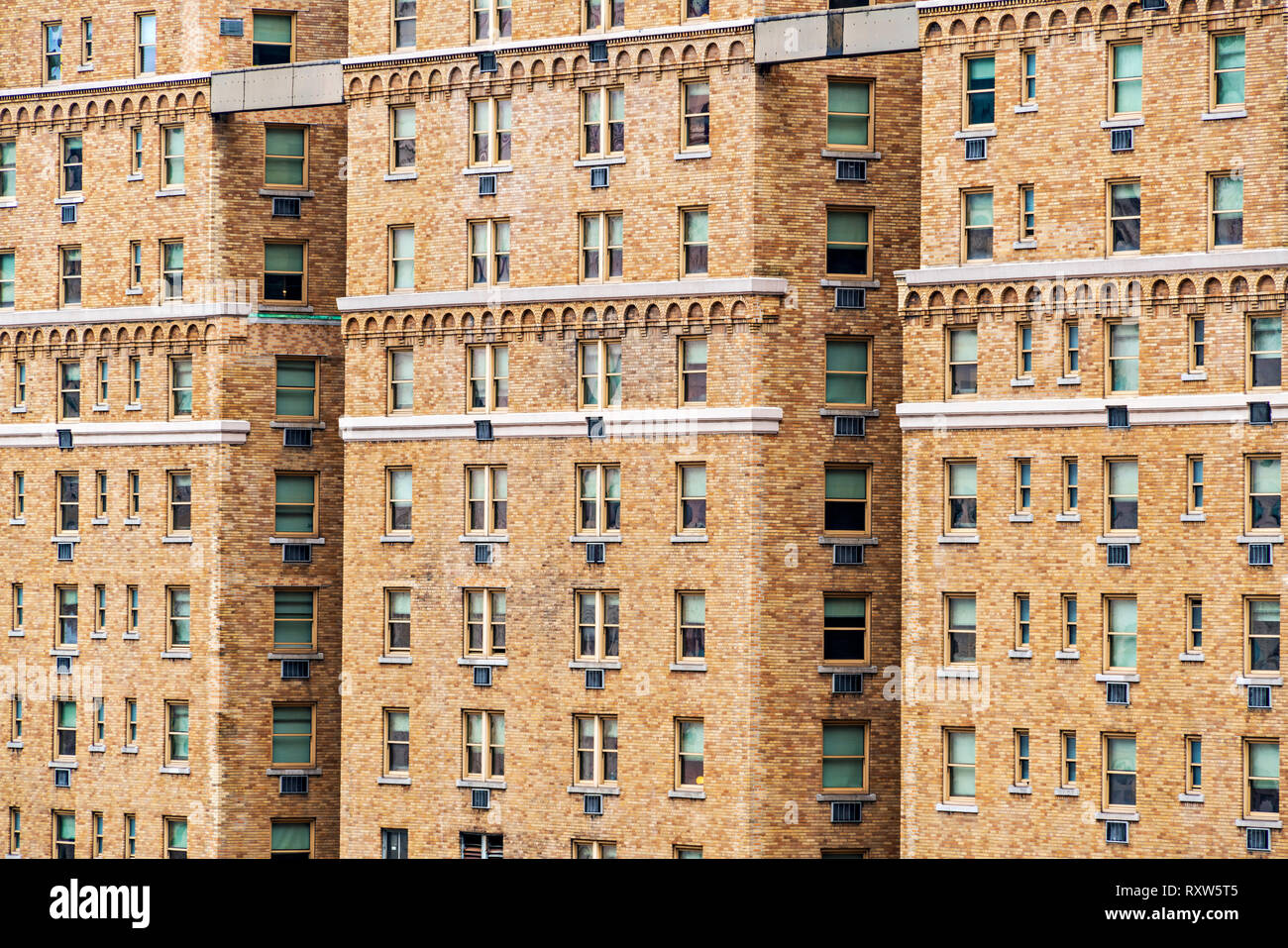 Brick Building With Many Windows Stock Photo - Alamy