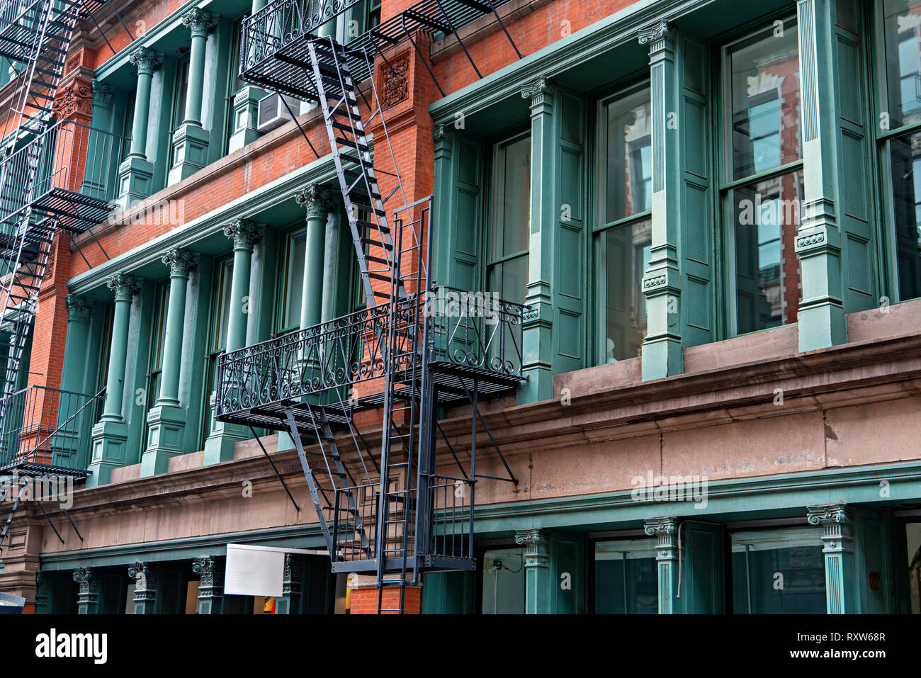 Building Facade With Fire Escape Stock Photo - Alamy