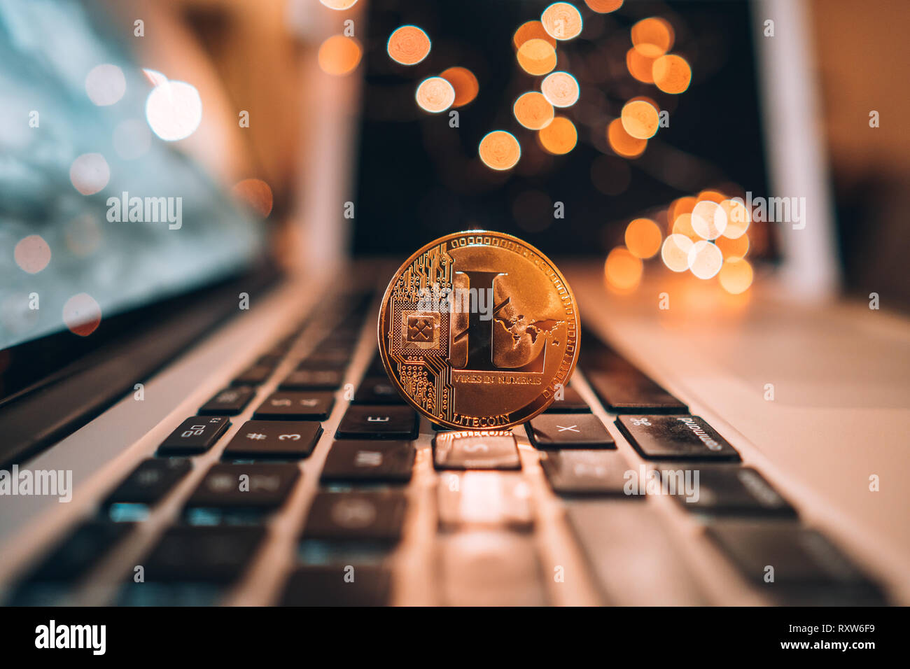 Lightcoin coin money on computer laptop keyboard Stock Photo - Alamy