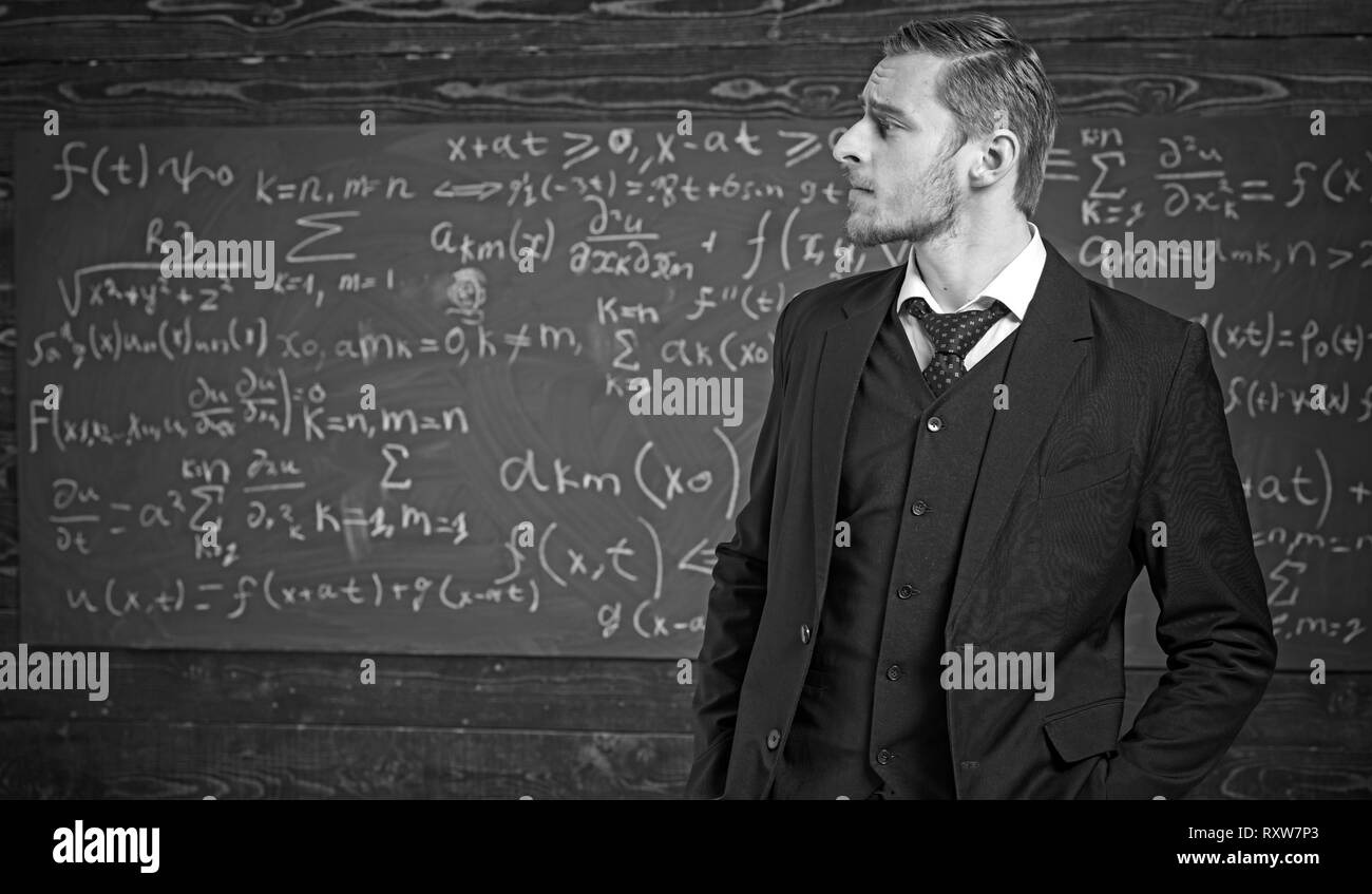 Intelligent man in suit at elite university. Side view blond guy with ...