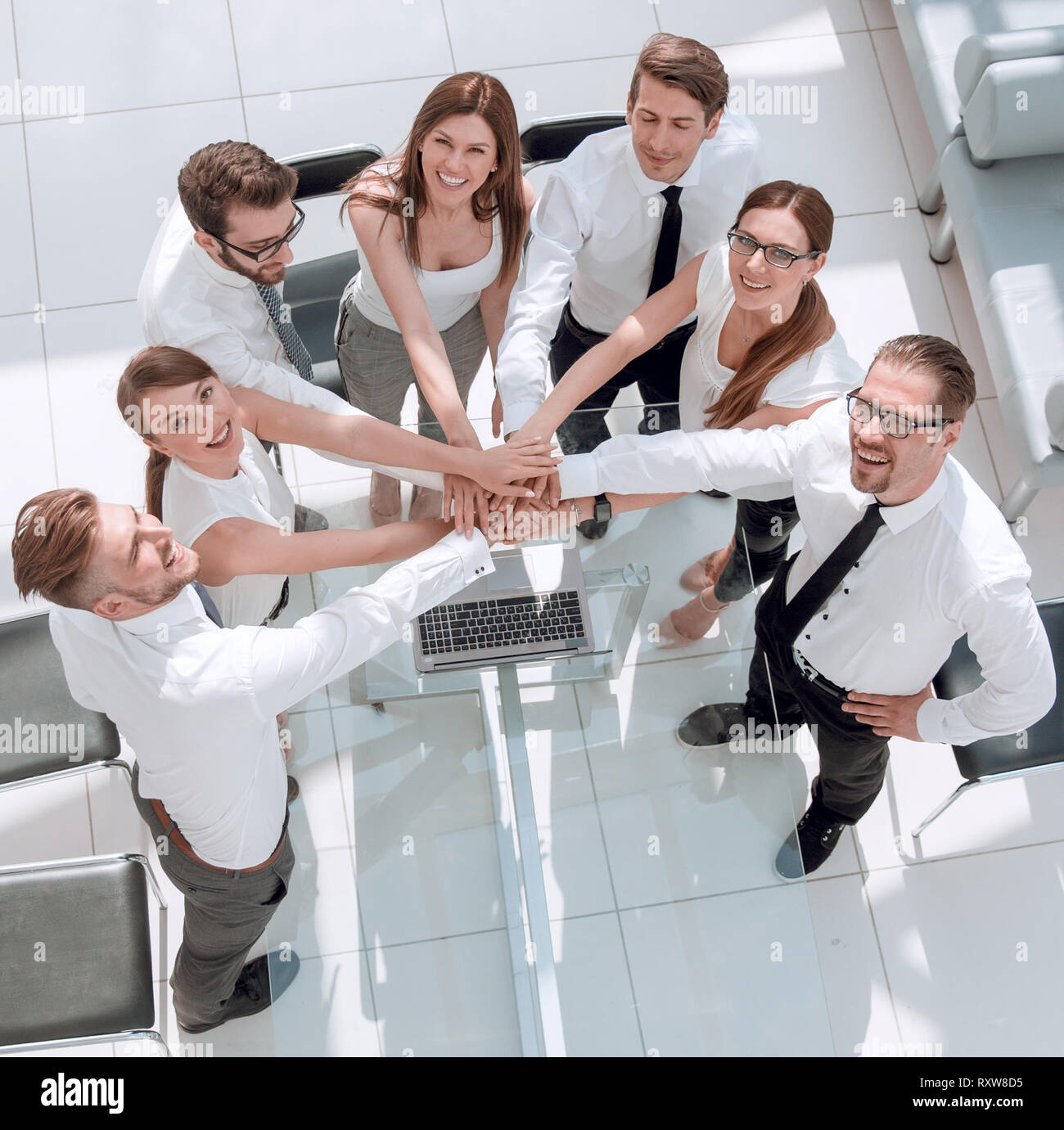 top view .a group of like-minded people standing in the office Stock ...