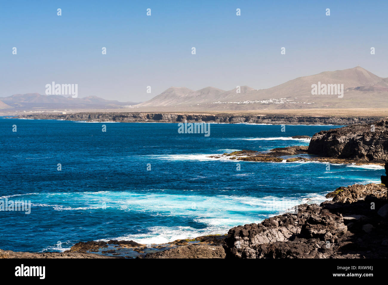 Trekking along volcanic coastline hi-res stock photography and images ...