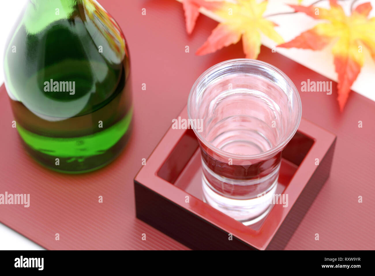 Japanese wooden box masu with sake on wooden tray, on white background ...